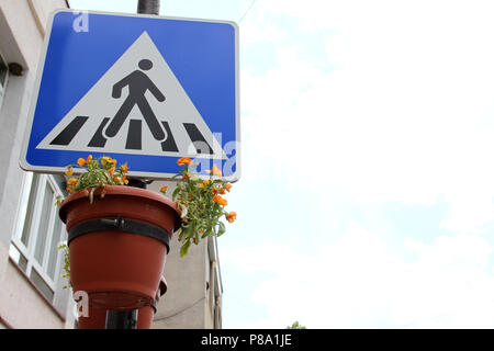Pedestrian crossing. Square blue and white road sign with walking man ...