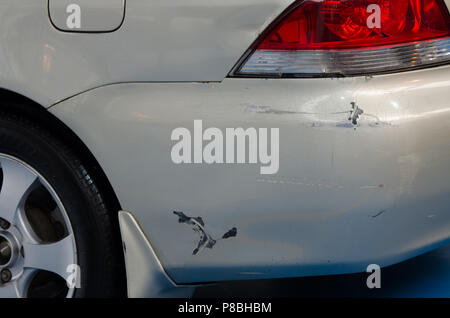 Rear bumper accident damaged car Stock Photo - Alamy