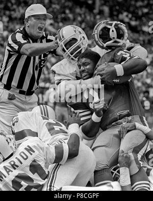 San Francisco 49ers' Carl Monroe scrambles to evade a tackle by ...