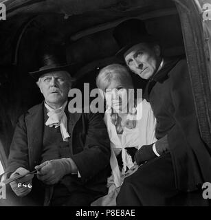 THORLEY WALTERS, SUSAN DENBERG and PETER CUSHING in a scene from ...