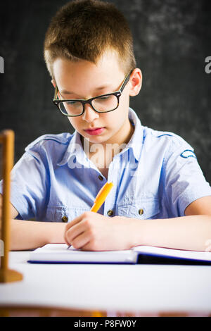 Boy with abacus studying math at home Stock Photo - Alamy