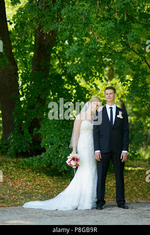 nice portrait of beautiful and young groom and bride outdoors Stock ...