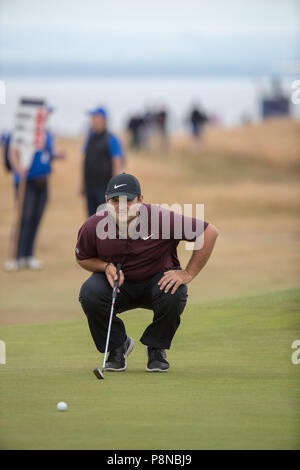Patrick Reed lines up a putt on the second hole during the first round ...