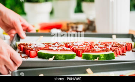 Step by step. Watermelon wedges garnished with chocolate and sea salt ...