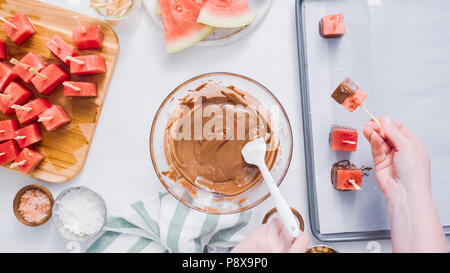 Dipping watermelon cubes into melted chocolate and garnishing with sea ...