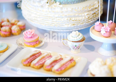 Beautiful desserts, sweets and candy table at wedding reception ot ...