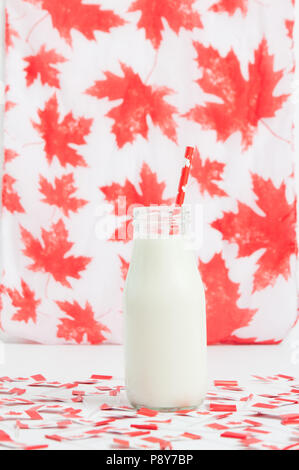 Canadian dairy: milk in a bottle with Canadian flags Stock Photo - Alamy