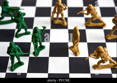 toy plastic soldiers armies facing each other on a world map Stock ...