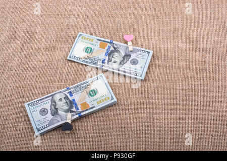 heart icon bundle of US dollar placed on a linen canvas Stock Photo - Alamy