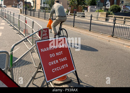 narrow lanes do not overtake cyclist sign at temporary roadworks in ...