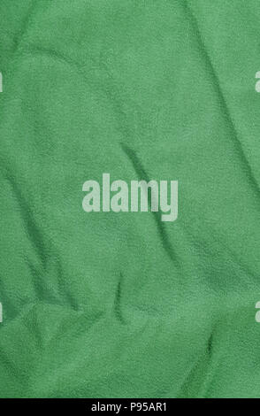 Wrinkled, crumpled green fabric texture background. Wrinkled and ...