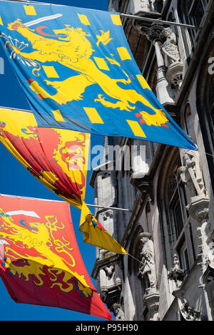 Gouda City Hall with flags during the weekly cheese market Stock Photo ...