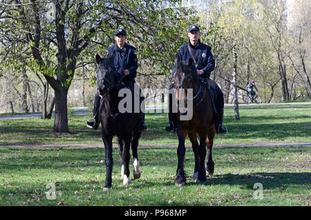 Mounted police squad keeping order on the street during mass event ...