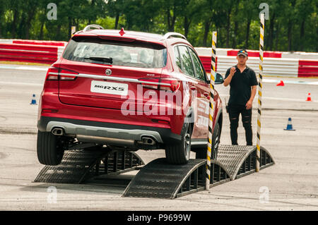 test drive of SUV car with obstacles on field Stock Photo - Alamy