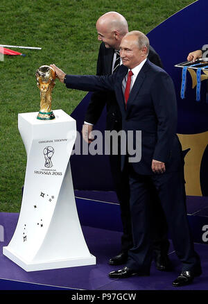 Russian President Vladimir Putin plays with his dog Yume, a Akita-inu ...