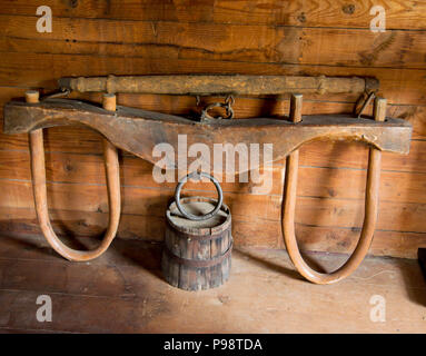 An antique wooden oxen yoke in the barn of the pioneer Cove Creek Ranch ...