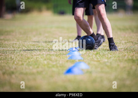 Boys Practicing Soccer on School Field. 10 Years Old Kids on Football ...
