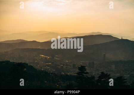 Looking out over a misty Sarajevo at sunset from Bistrik Tower, on top ...