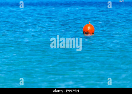 Buoy at blue ocean like mergency sign for sailing boat Stock Photo - Alamy