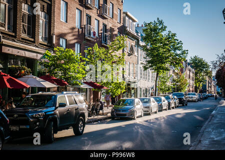 Cars parked on city street at sunset Stock Photo - Alamy