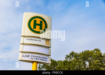 GERMANY Berlin Bus and tram stop sign, green H within yellow circle ...