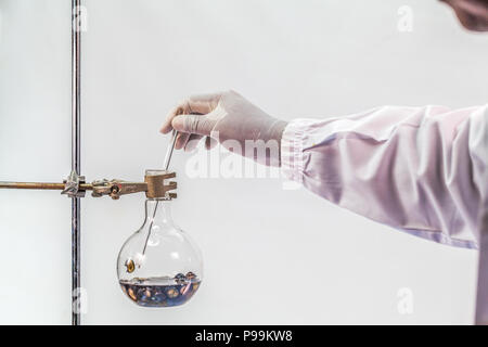 a scientist in Laboratory refining equipment Distillation of Alcohol ...