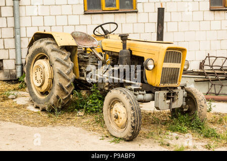 An old tractor produced in the 70s of the 20th century.Isolated photo ...