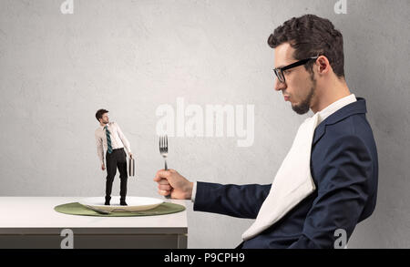 Tiny scared weak businessman almost devoured by great power Stock Photo ...
