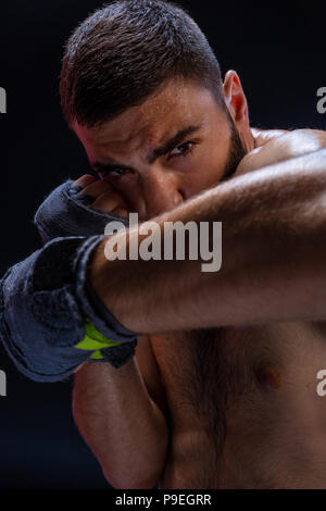 Double arm block. Boxing trainer showing defensive techniques. Combat ...