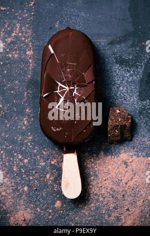 High angle view of candy bar with glazed baked donuts, cakes, sweets on ...