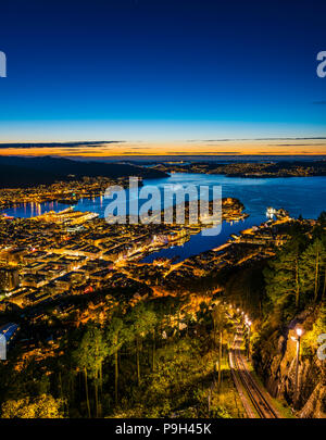 Bergen at night with a view of the Fløibanen funicular, northern lights ...