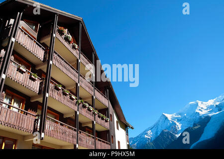 Traditional European alpine ski chalet hotel, view of the Alps in the ...