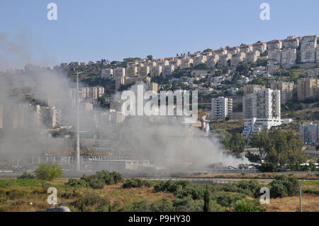 Heavy smoke is seen from a fire in the Haifa recycling facility. Haifa ...