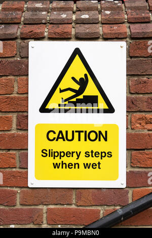 Slip hazard warning sign, in a hospital corridor Stock Photo - Alamy