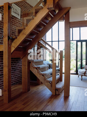 Modern staircase in barn conversion with exposed beams, Field Place ...