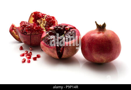 Two open pomegranate with revealed grains isolated on white background ...