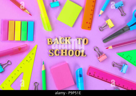 School supplies on violet background ready for your design. Flat lay ...