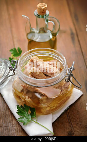Fish oil in a glass bottle placed on a wooden floor and a red heart ...