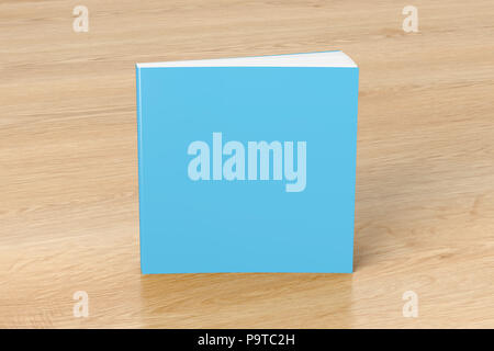 Blank cyan square soft cover books open and standing on black ...