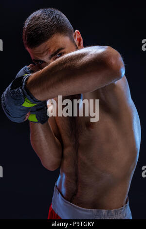 Double arm block. Boxing trainer showing defensive techniques. Combat ...