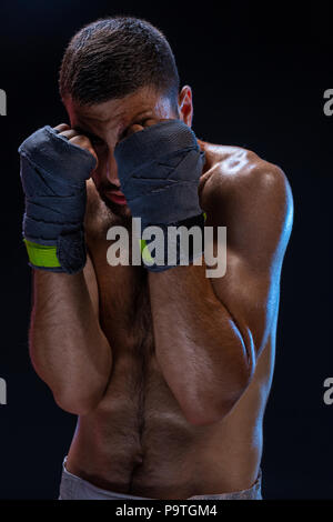Double arm block. Boxing trainer showing defensive techniques. Combat ...