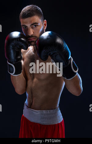 Double arm block. Boxing trainer showing defensive techniques. Combat ...