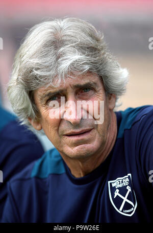 Manuel Pellegrini manager of West Ham United controls the ball during ...