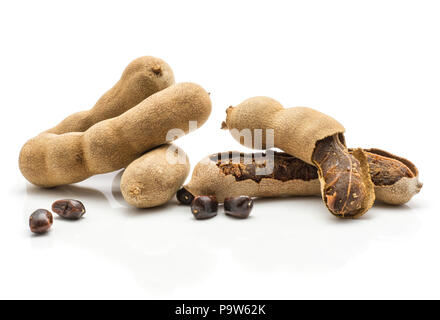 Two brown tamarind seeds on white background Stock Photo - Alamy