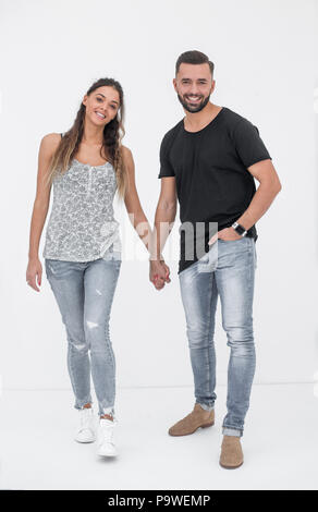 in full growth. young couple walking together Stock Photo - Alamy