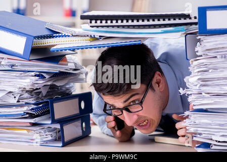 Extremely busy businessman working in office Stock Photo - Alamy