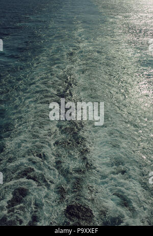 Wake of a cruise ship against the light Stock Photo - Alamy