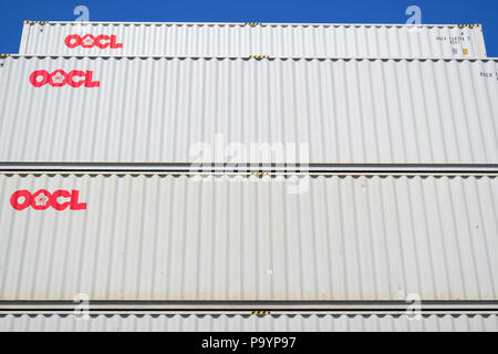 OOCL 40 ft intermodal containers stacked in harbor. OOCL is a Hong Kong ...
