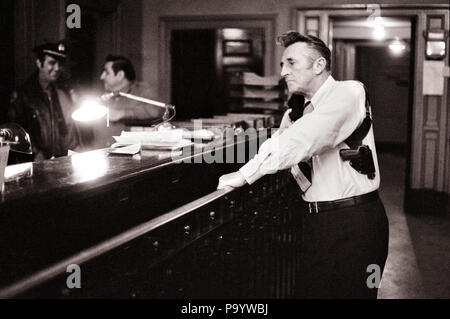 Old fashioned detective with gun on white background Stock Photo - Alamy