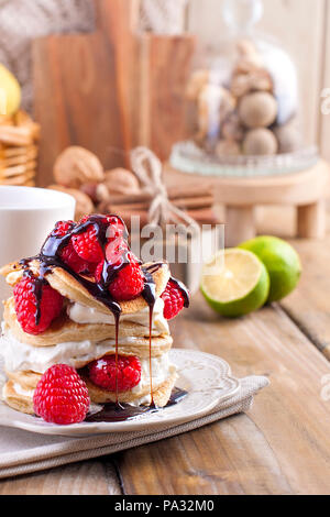 The homemade pancakes with chocolate cream and raspberries on it Stock ...